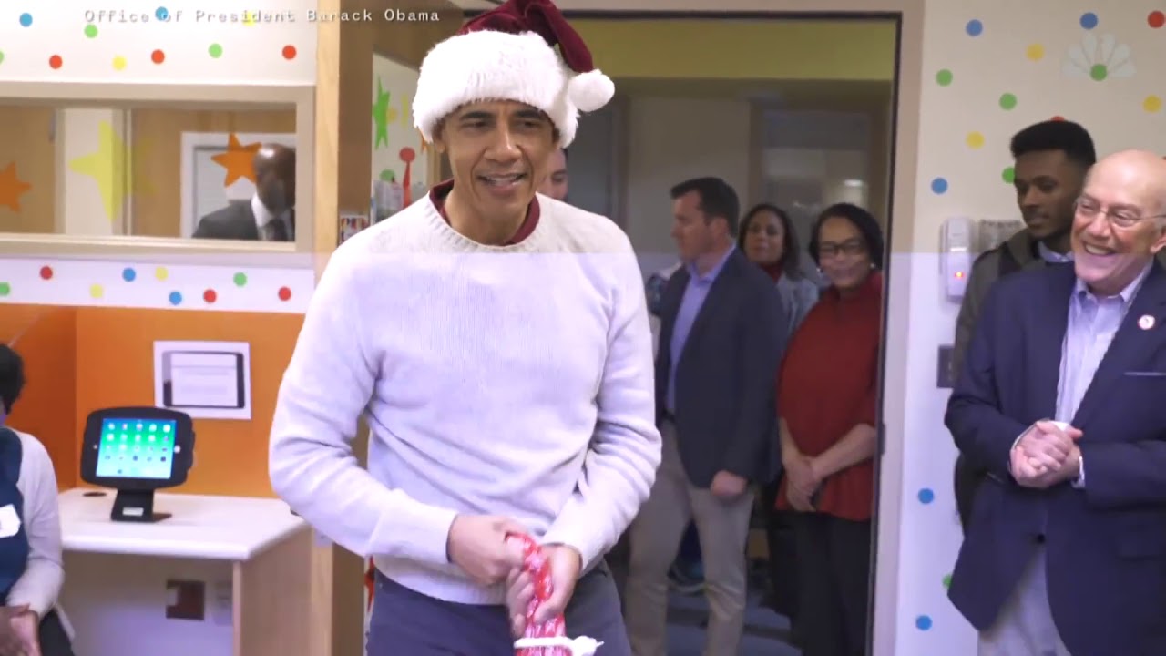 Barack Obama Delivers Holiday Gifts Wearing Santa Hat At Children’s ...