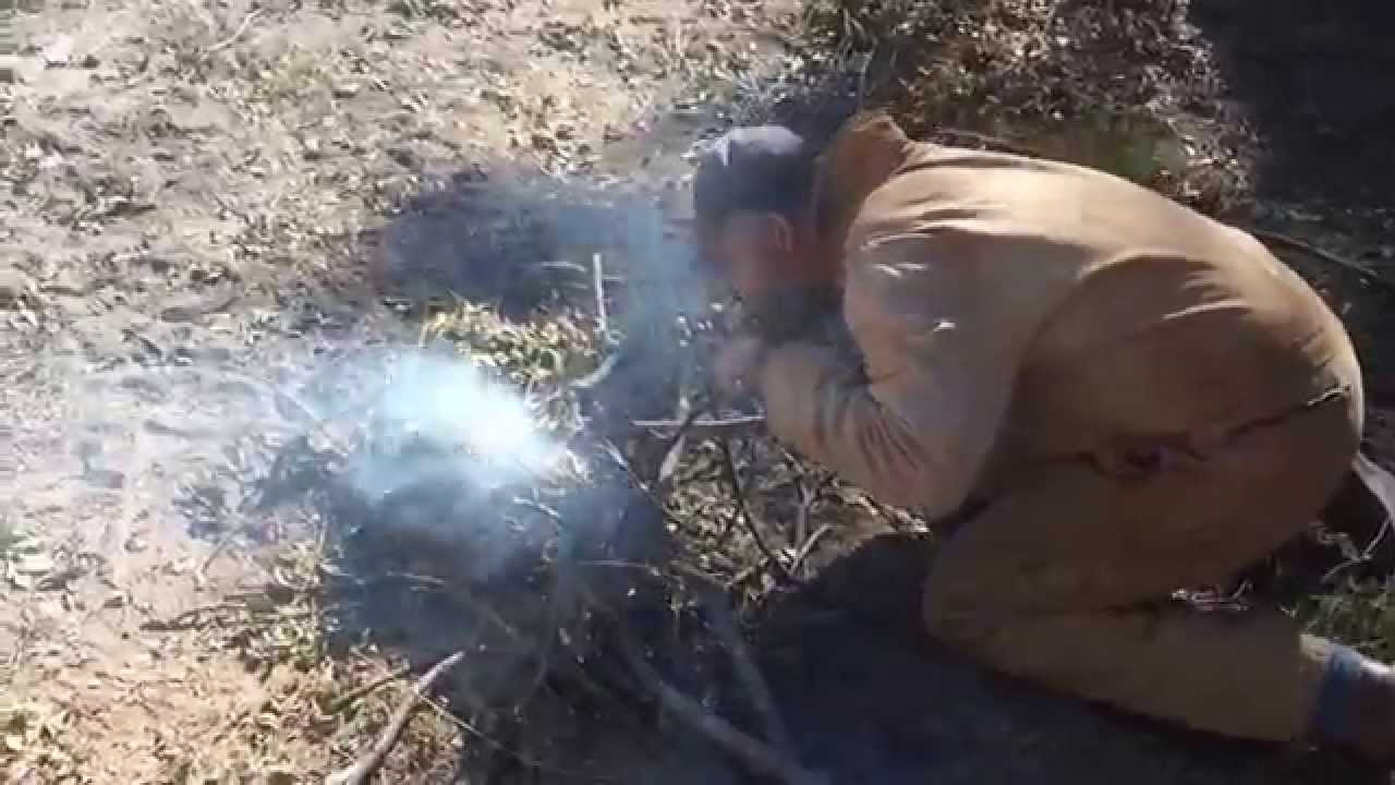 Starting a fire with sticks - YouTube