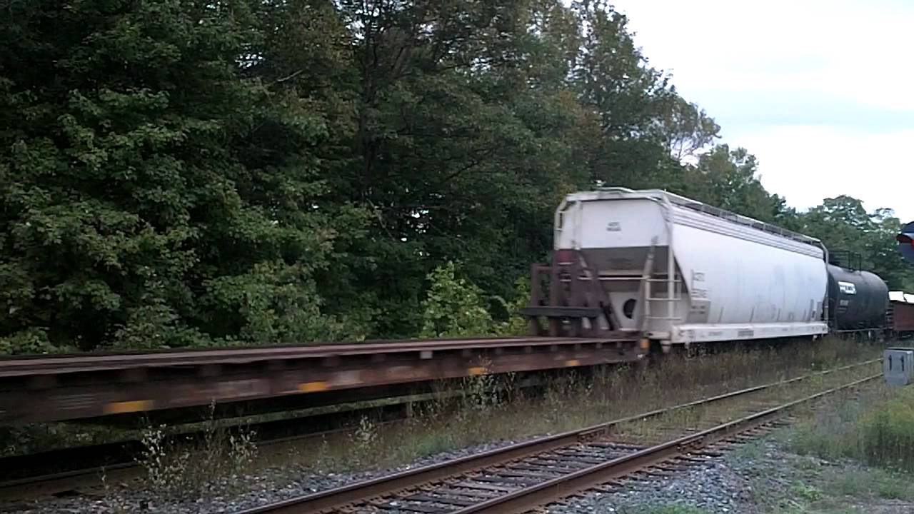 CN Engines 2203, 5700 & 6001 lead this long NB mixed freight/Autorack ...