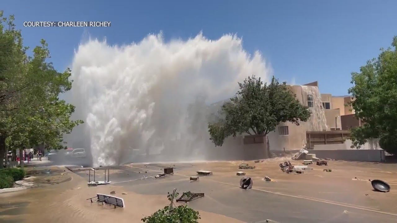 Water main break explodes out of road in NE Albuquerque - YouTube