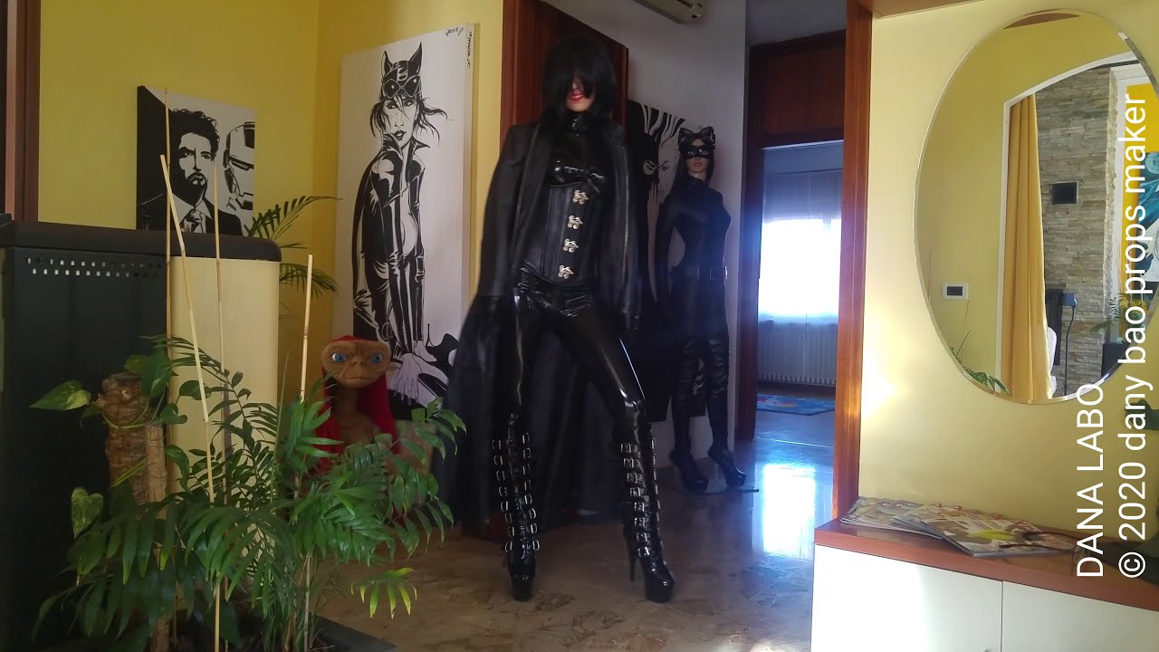 DANA LABO - the woman in black, latex catsuit, gloves, corset, coat and ...