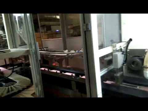 Sanitary napkins auto infeeding into bagger with stacker - YouTube