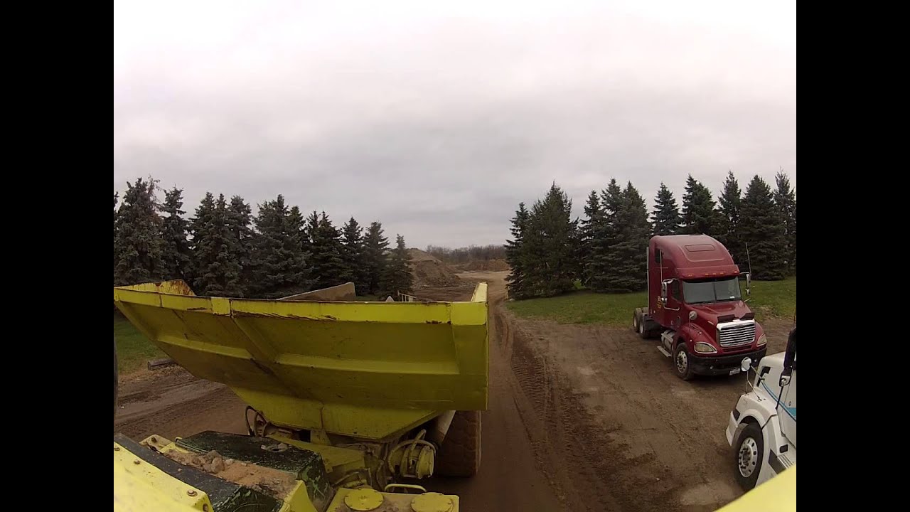 Hauling Class 2 sand with a Euclid A-464 - YouTube