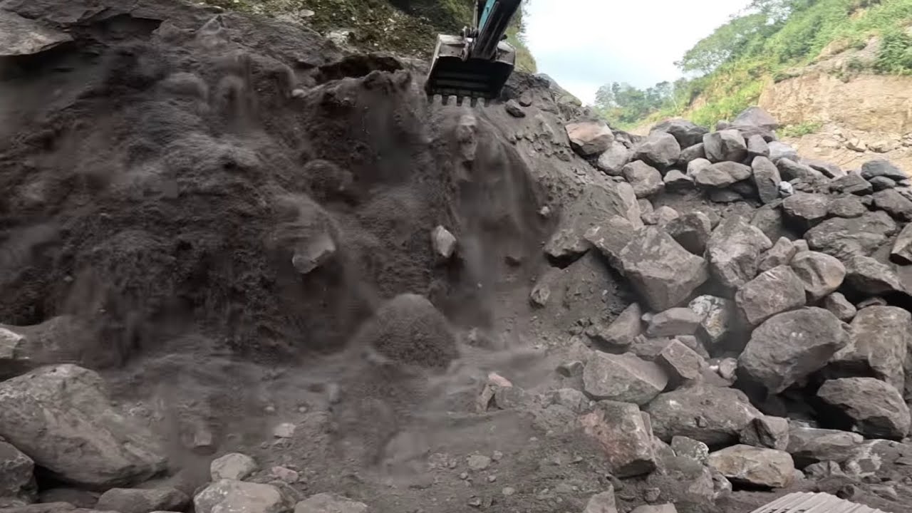 Continue digging sand in between the piles of previous sand mining ...