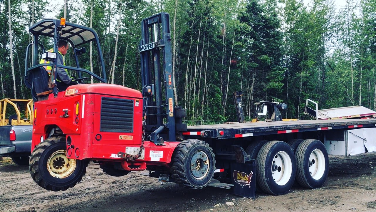 LOADING MOFFETT PIGGYBACK ON FLATBED TRAILER - YouTube