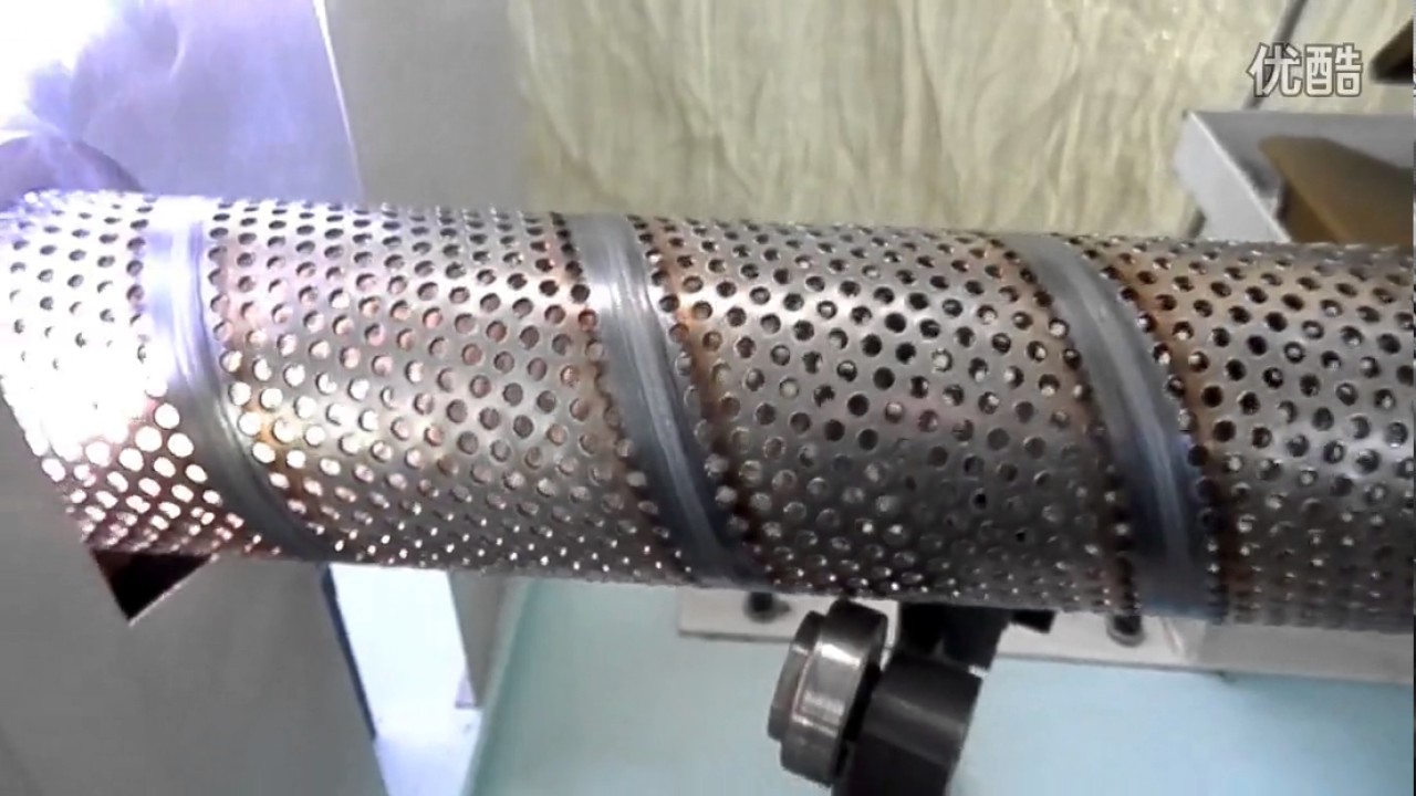 spiral welding filter core machine - YouTube