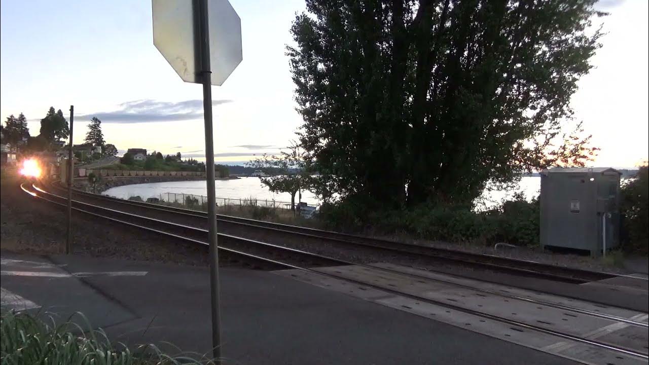 (Northbound) BNSF Coal Train BLAST THROUGH the Sunnyside Beach Pedestrian Railroad Crossing ...
