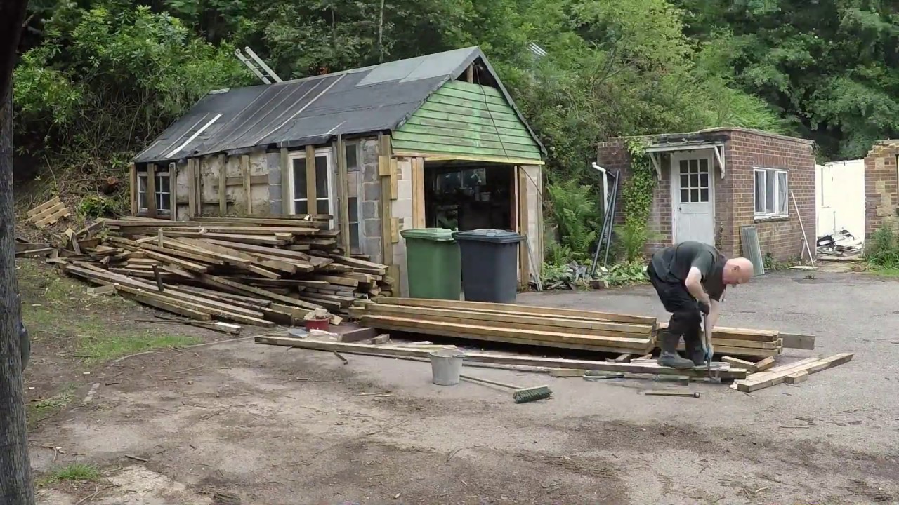 denailing reclaimed woodpile - YouTube