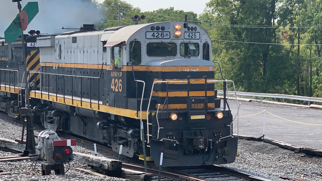 WNY&P Alco unit leading a LA&L 6 car train through industry - YouTube