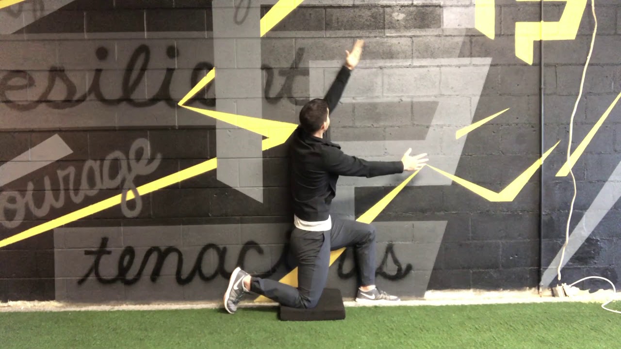1/2 kneeling T-spine windmill against wall - YouTube