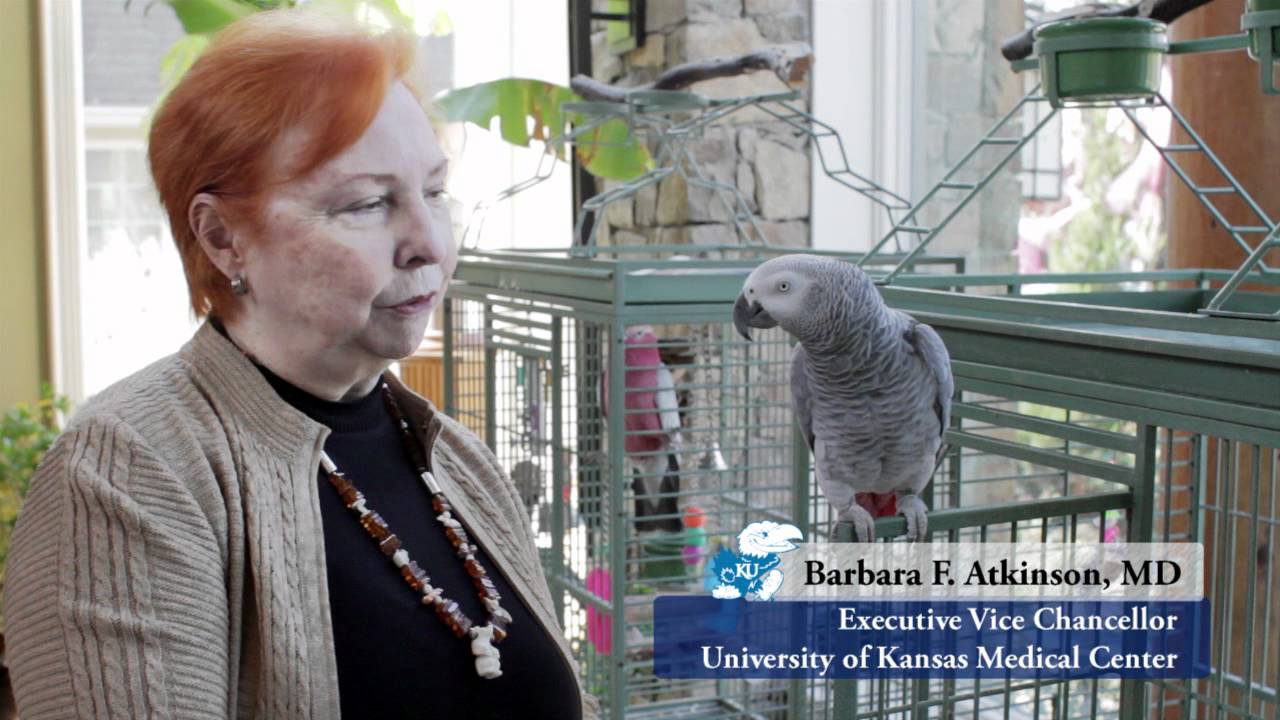 KUMC's Barbara Atkinson, MD, and Buddy the "Rock Chalk"-singing parrot ...