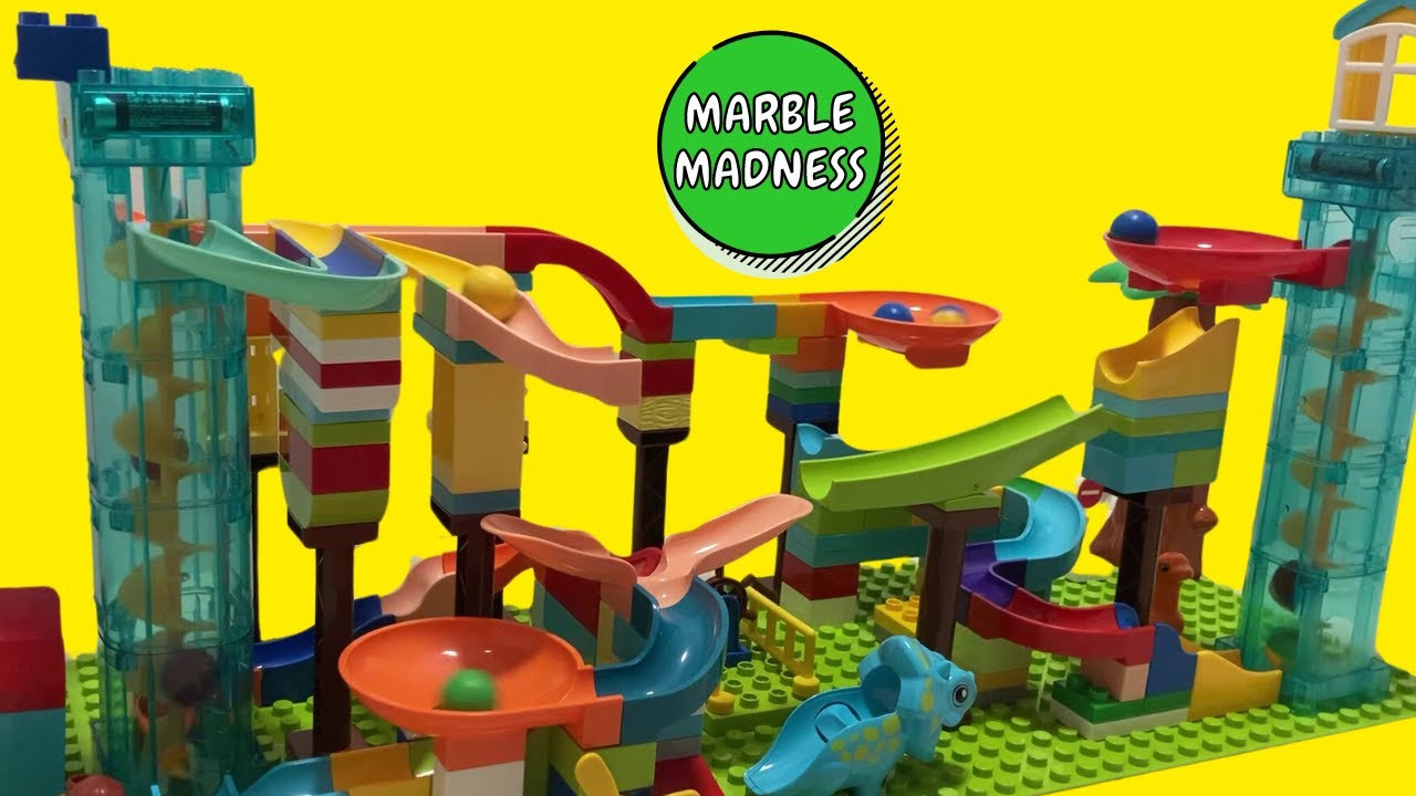 Marble Maze Madness Marbles Jumping down a see-saw slide into a v ...
