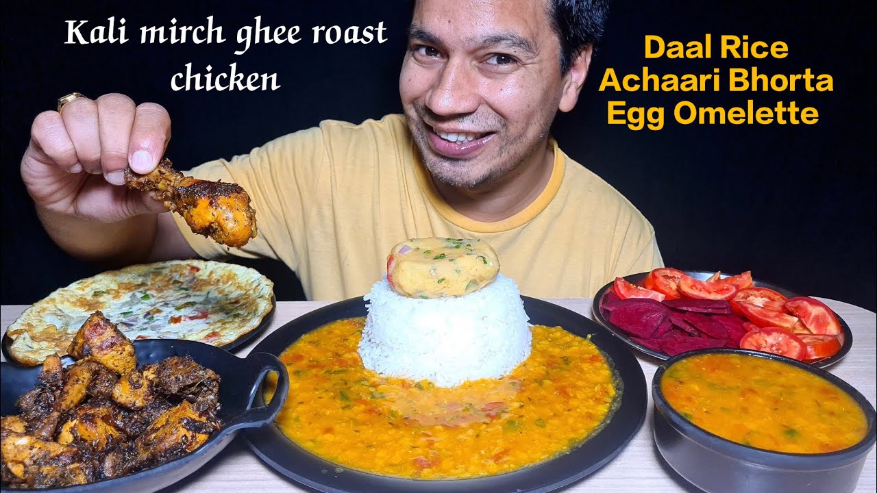 Eating indian food Daal tadka rice, Kali mirch ghee roast chicken ...