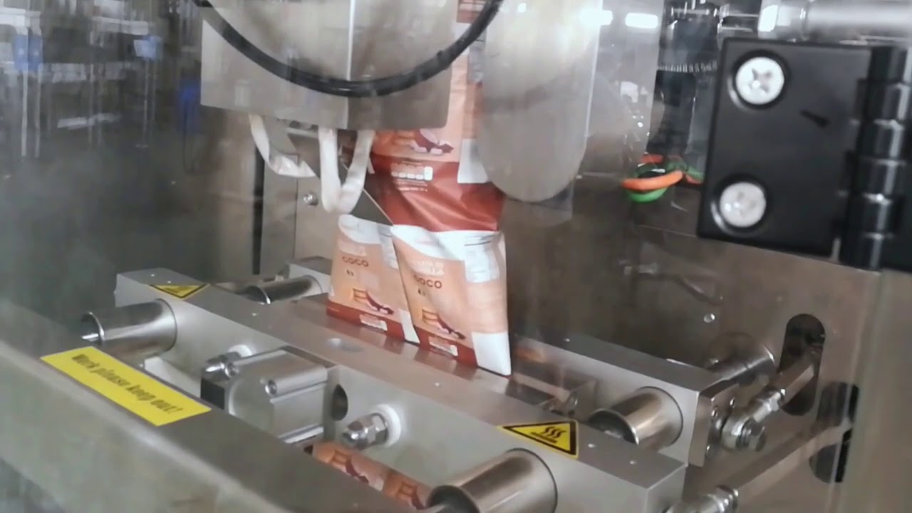 Servo motor packing machine with punch hole - YouTube