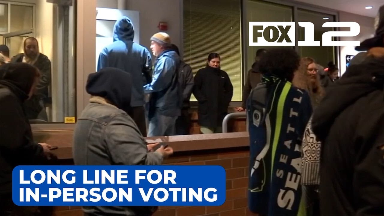 Hundreds line up to vote in person on election night at Clark Co ...