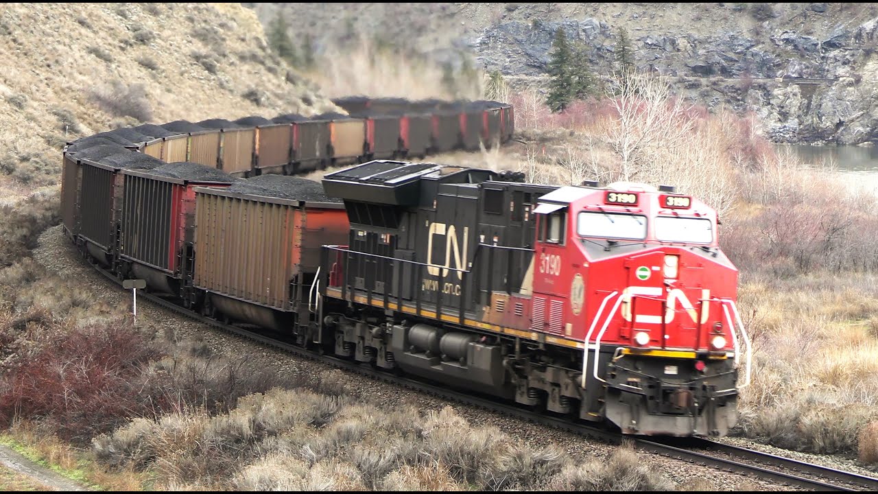 [4K] HUGE Canadian National coal train snaking through the Thompson ...