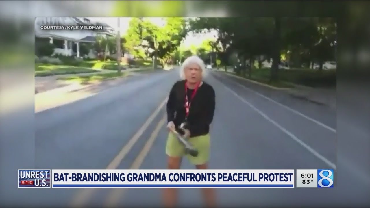 Bat-brandishing grandma confronts peaceful protest - YouTube