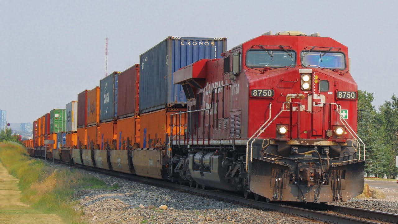 CP stack train with rumbling KCS units at rear at Ogden on the Brooks ...