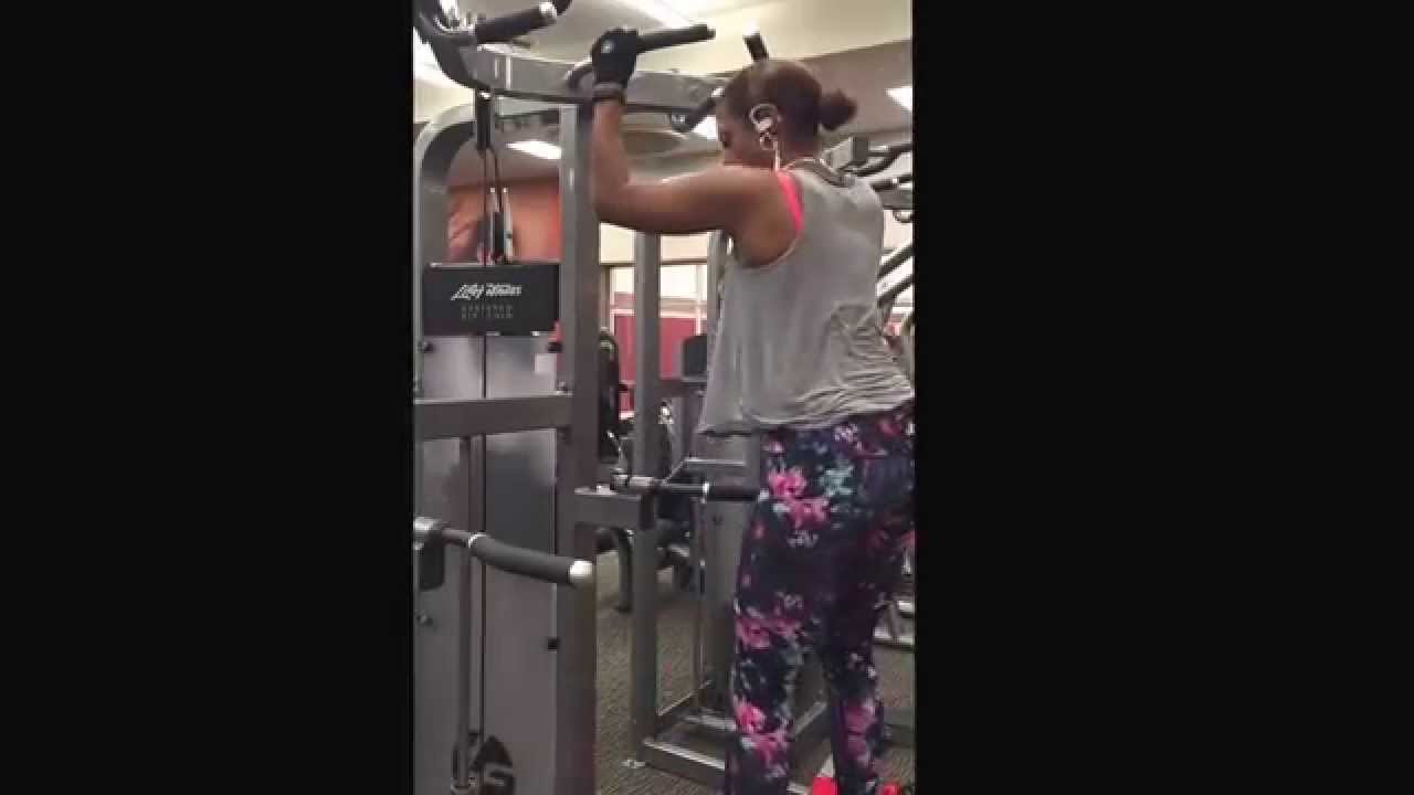 Glute pushdowns on assisted pull up machine - YouTube