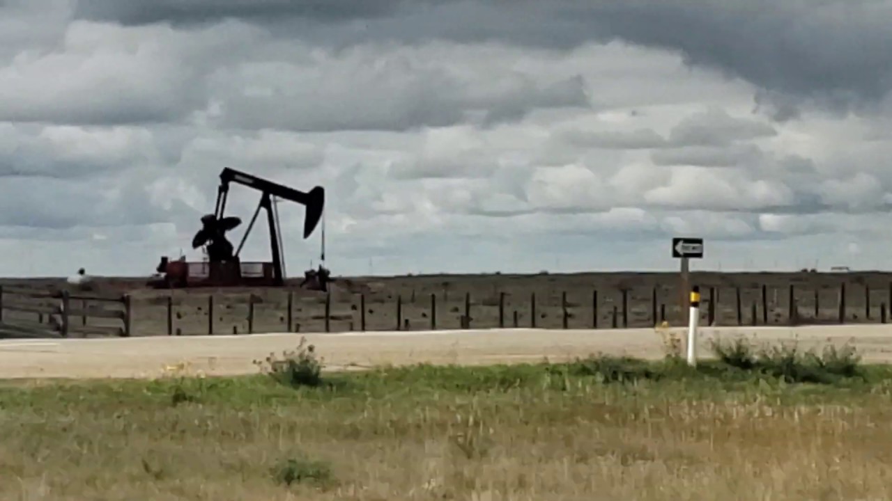 A working oil derrick in Alberta, Canada - YouTube