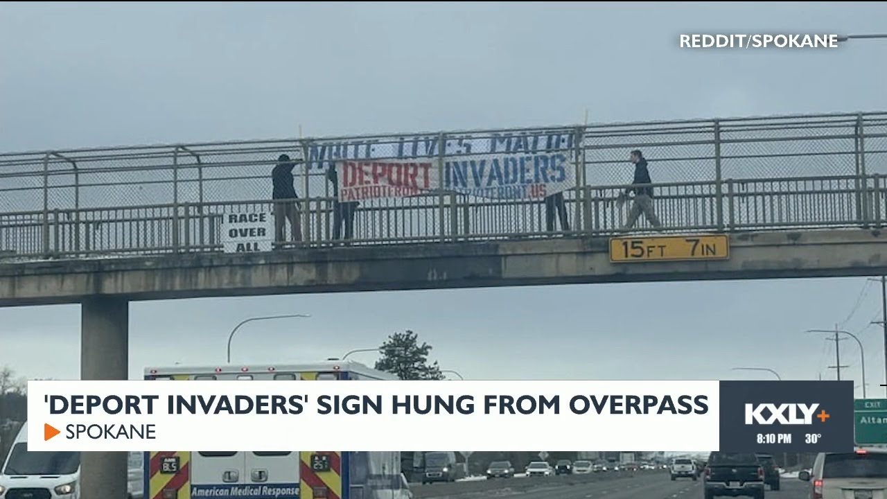 'Deport Invaders' sign hung from overpass - YouTube