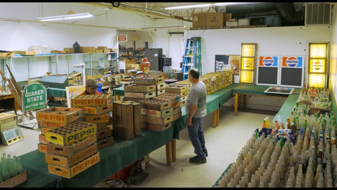 Auction Staff Decorates Middle Room with Bottles & Signs at Mebane ...