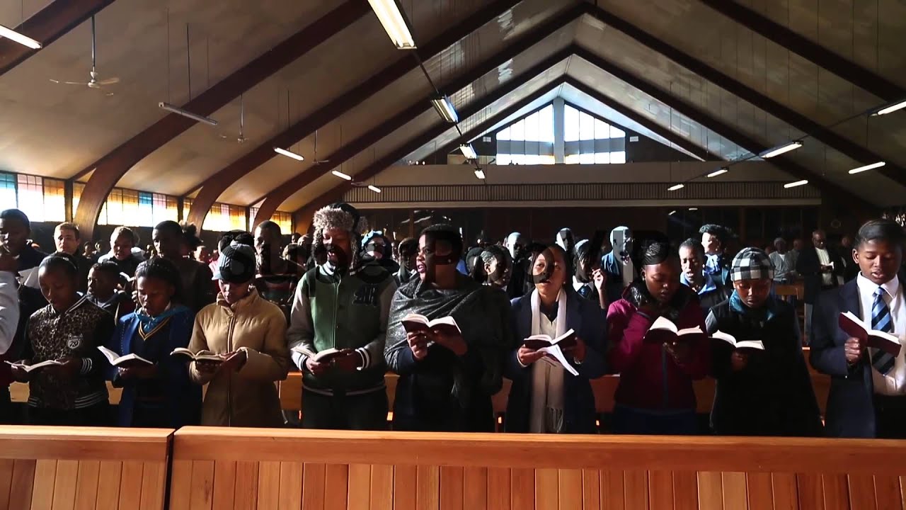 Long shot people singing at church. The congregation pray... - YouTube