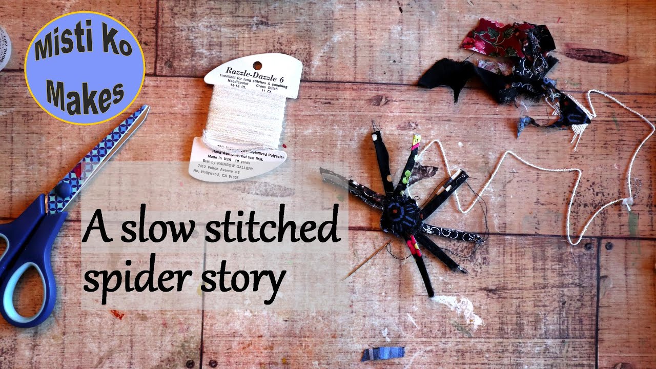 Hand stitching a little black spider using the tiniest fabric scraps ...