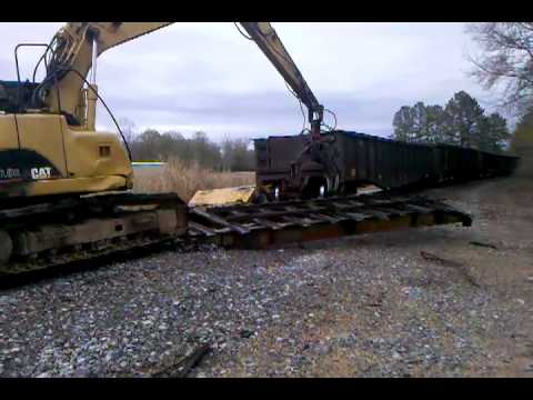 Unloading excavator off train car in alabama - YouTube