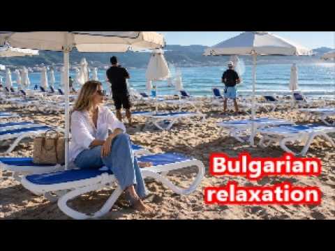 Mom is watching the beach season come to an end. Sunny Beach. Bulgaria. Sea, Waves, Umbrellas.