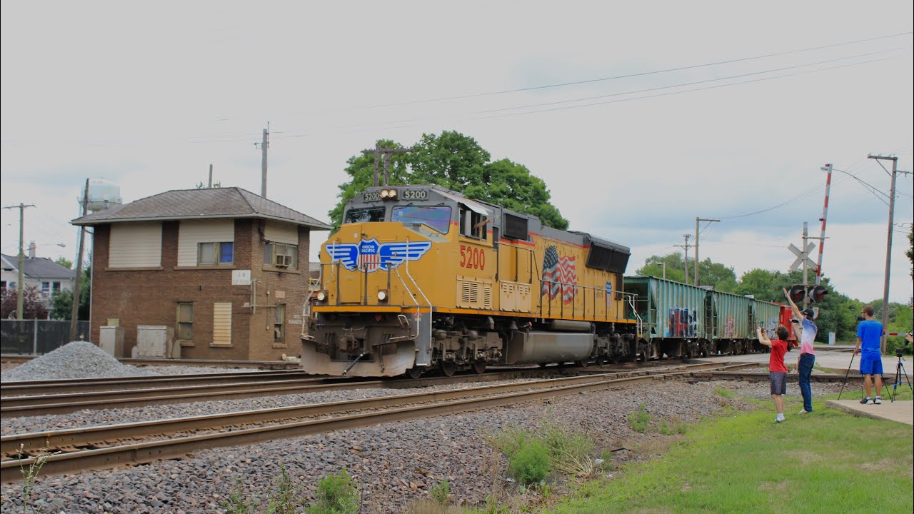 UP 5200 leads a UP Work train past JB Tower with a MoPac Caboose - YouTube