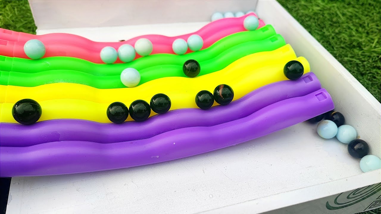 Marble run race!Drop marbles to run on a wooden, wavy plastic track ...