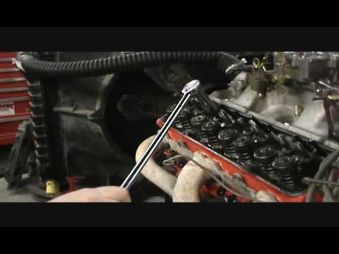 replacing rocker studs on 350 chevy on the motor - YouTube