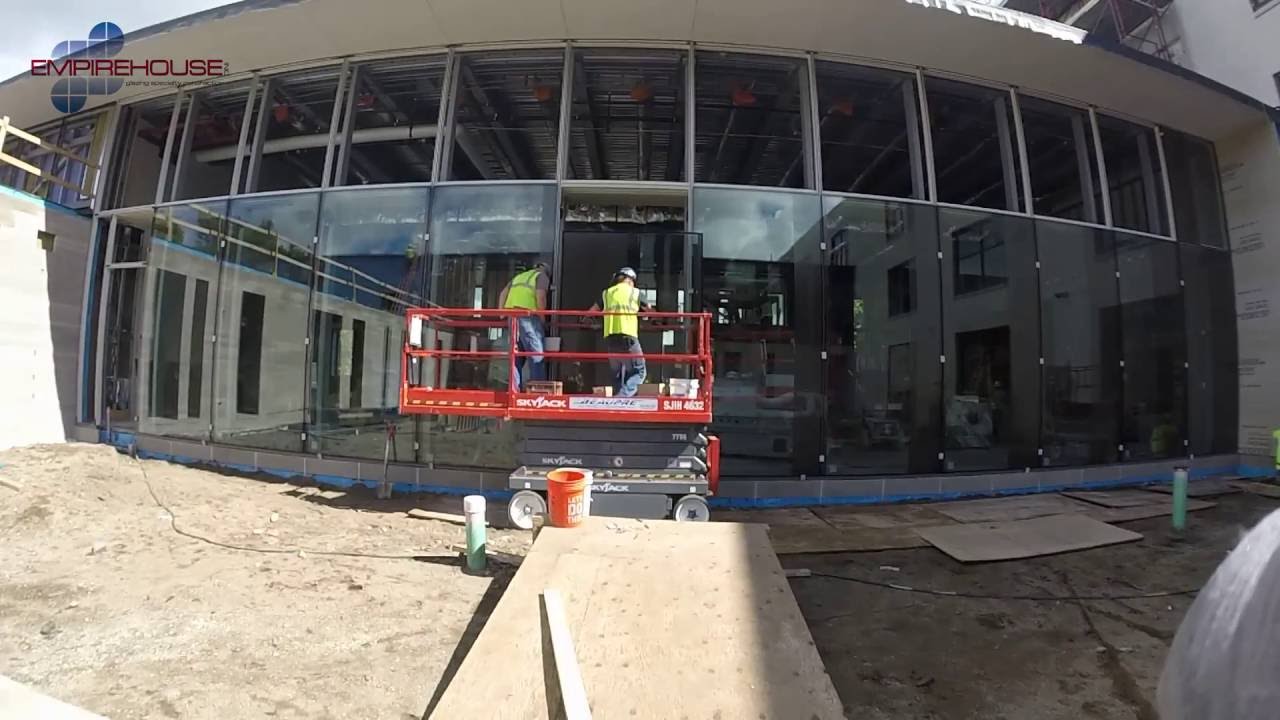 Empirehouse Glazing Large Glass Lite using a Scissor Lift - YouTube
