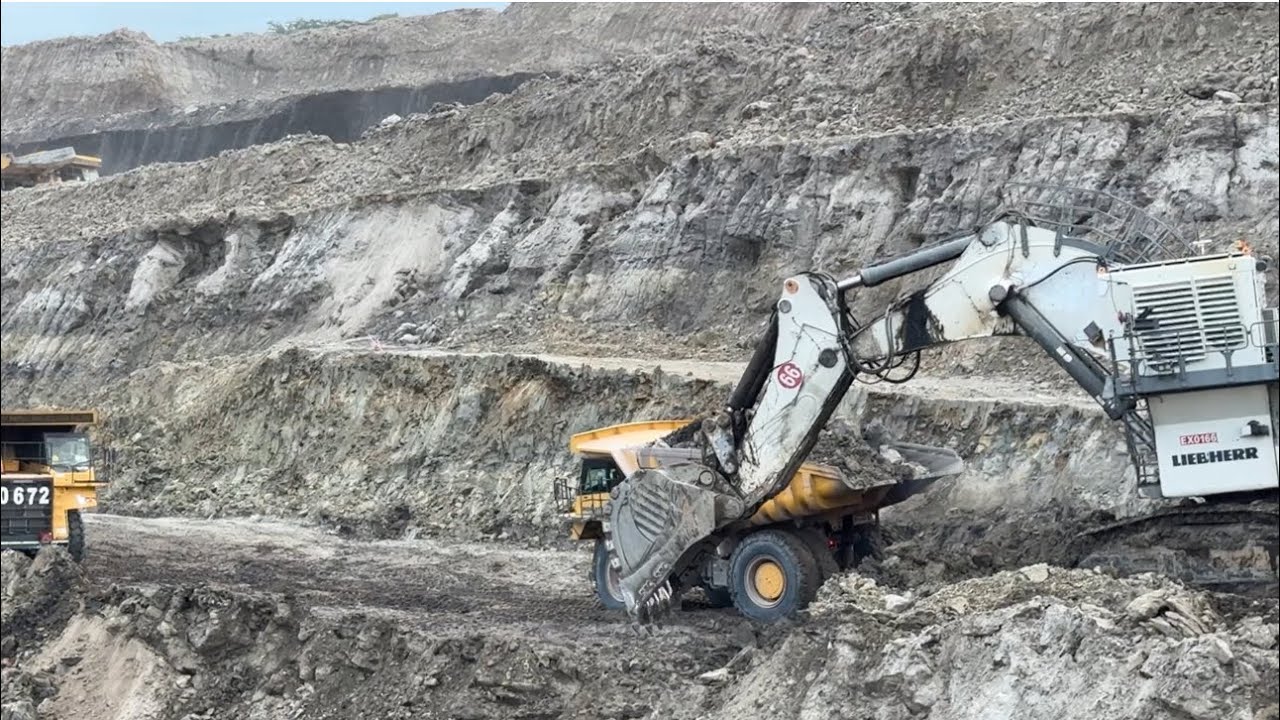 Liebherr’s R9350 Excavator in action || loading & expose coal mine site ...