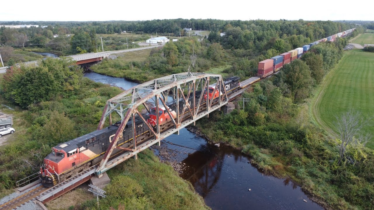 Awesome 4K Aerial View! Long Stack Train CN 120 w/DPU Crossing Bridge ...