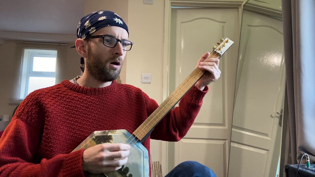 Biscuit tin / cigar box bass using nylon classical guitar strings - YouTube