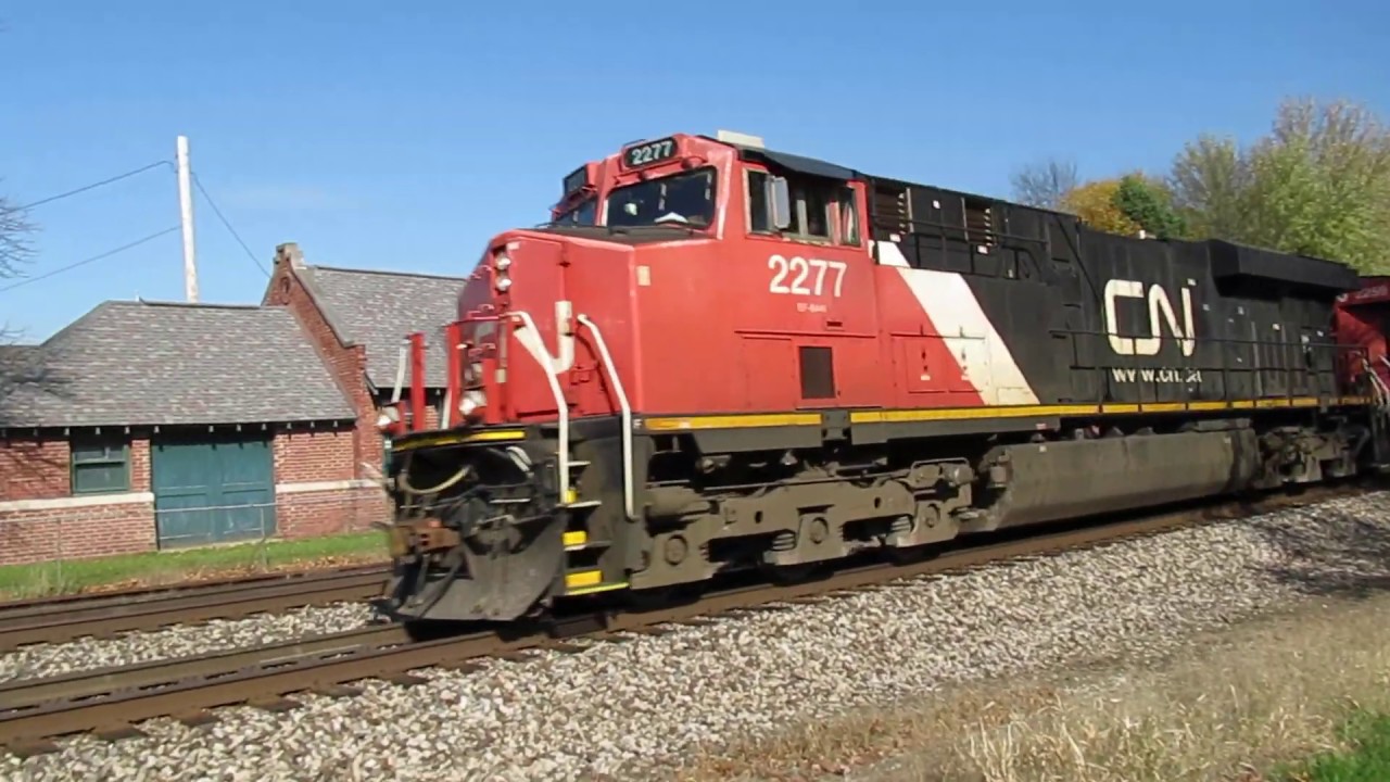 CN 2277, 2259 head West with a variety of BNSF freight cars in a train at Vicksburg, MI - YouTube