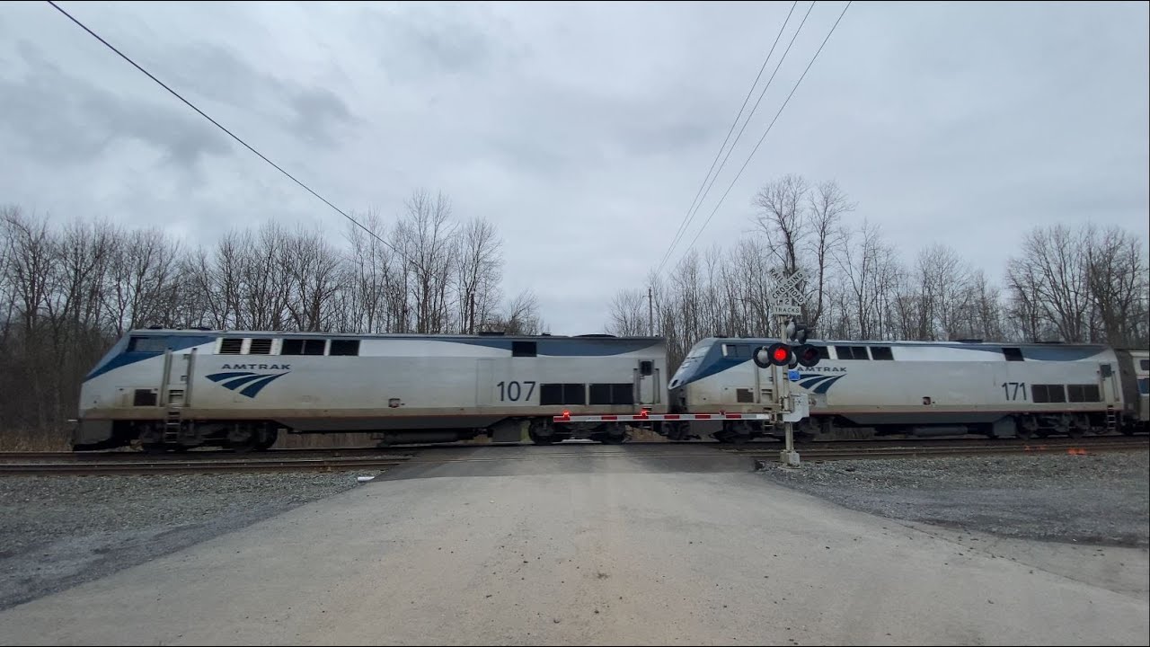 Wide Angle Shot of Amtrak 48 "Lake Shore Limited" Going Across Pump Rd ...