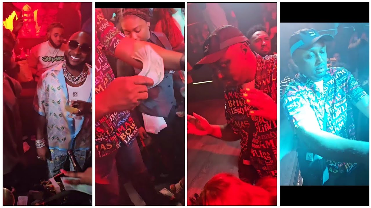 Davido's seen smiling at his aide, Isreal ,as he rained cash on a woman ...