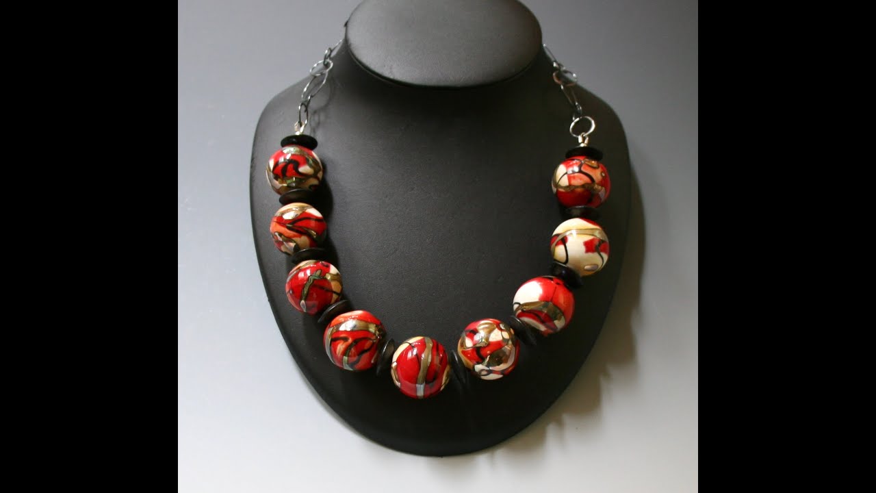 Blowing a hollow bead in a lampwork torch flame - YouTube