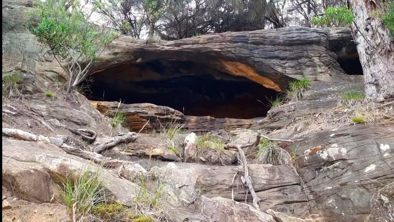 What a find! Awesome bush cave shelter with a hole in the roof! - YouTube