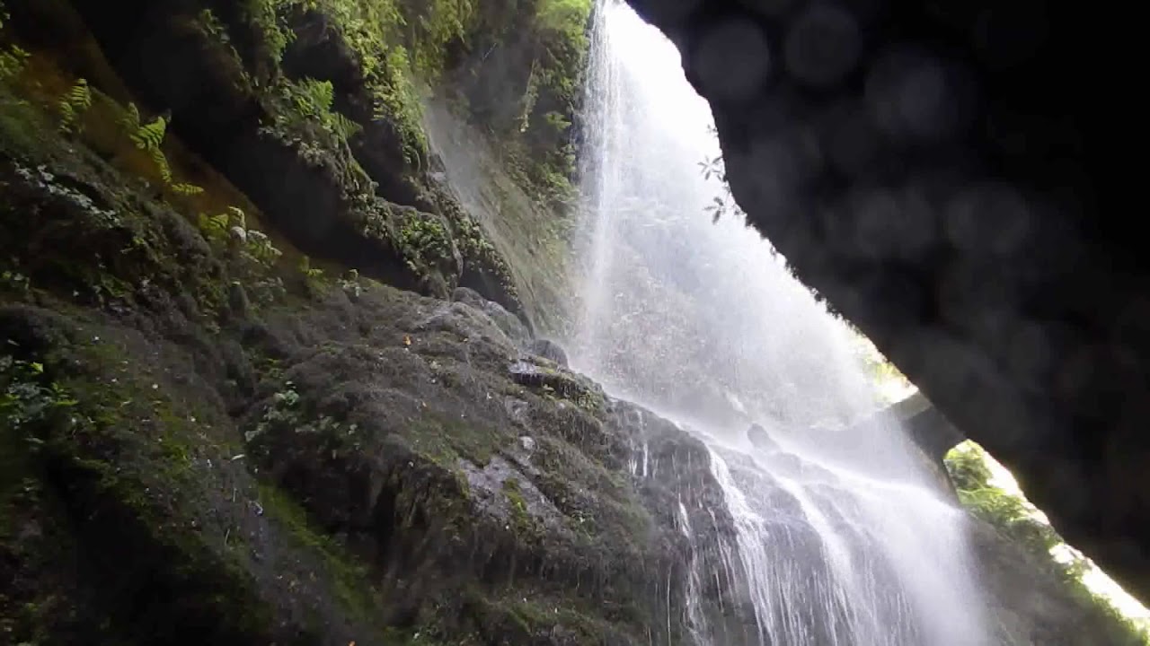 Water from waterfall falling on rocks - YouTube