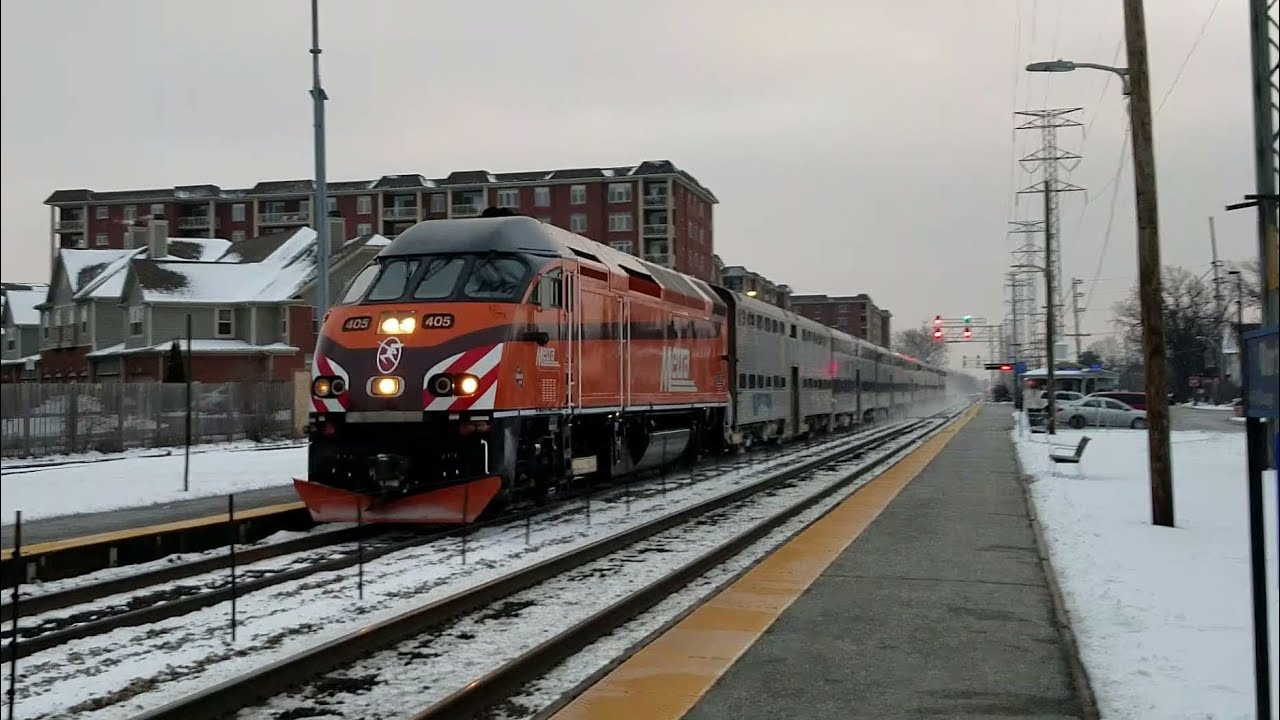 Metra 405 (Milwaukee Road heritage) flies by Morton Grove at speed ...