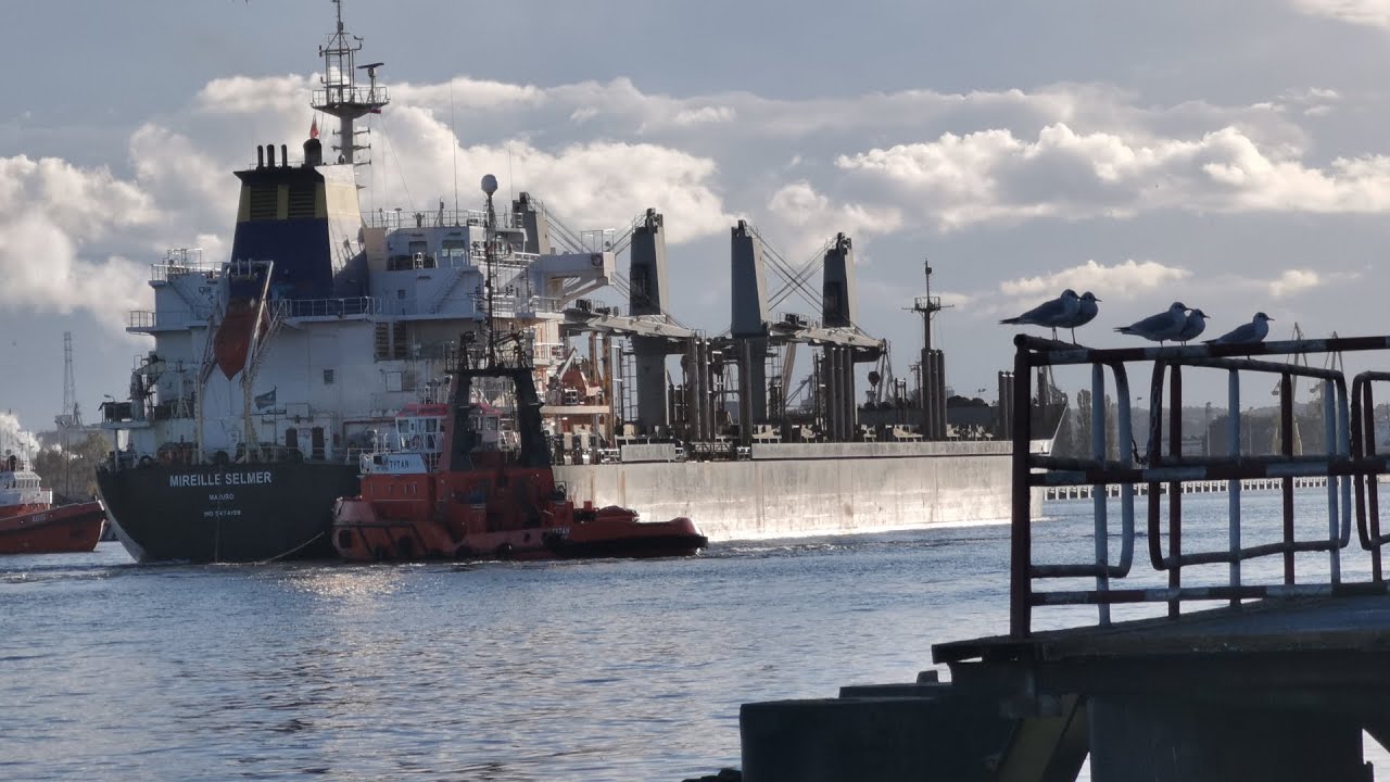 MIREILLE SELMER, 180m vessel is maneuvering in port, tugs are helping ...