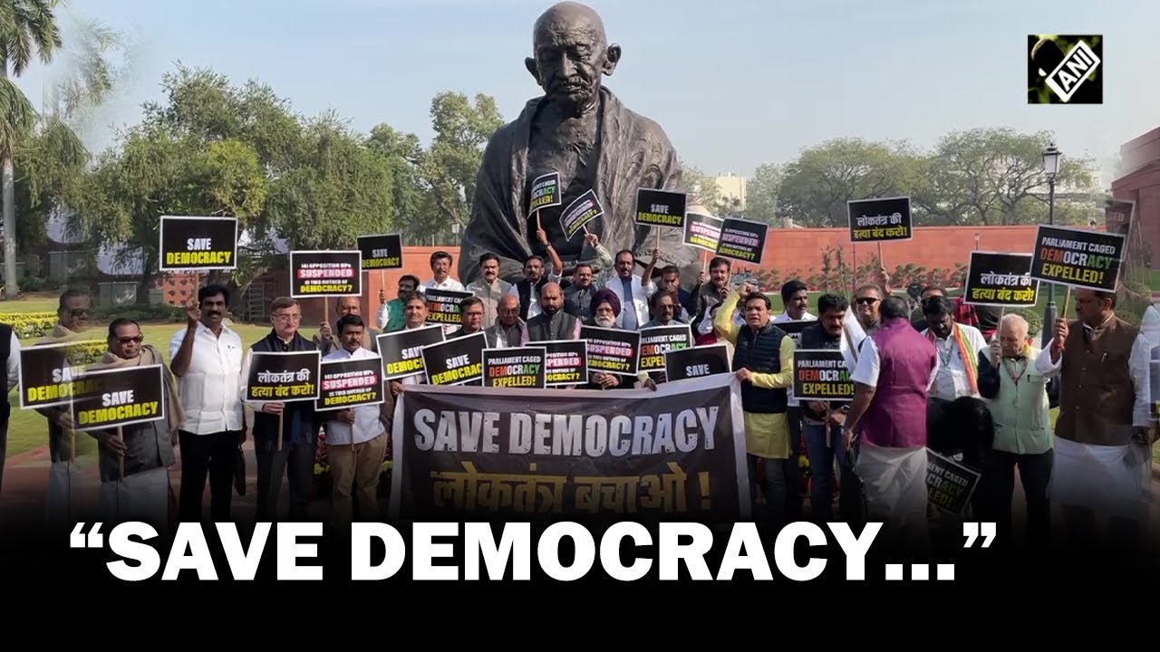 Suspended MPs raise “Save Democracy” slogans in front of Gandhi Statue ...