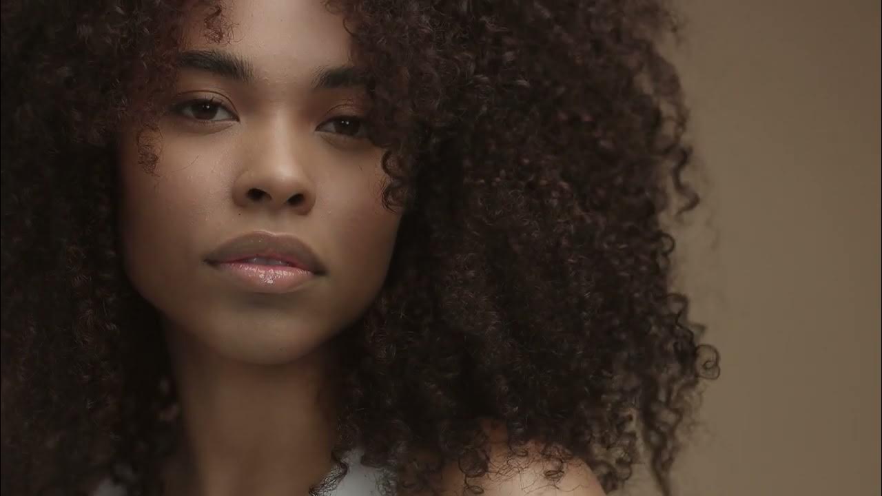 tilt moving camera showing closeup portrait of mixed race black woman ...