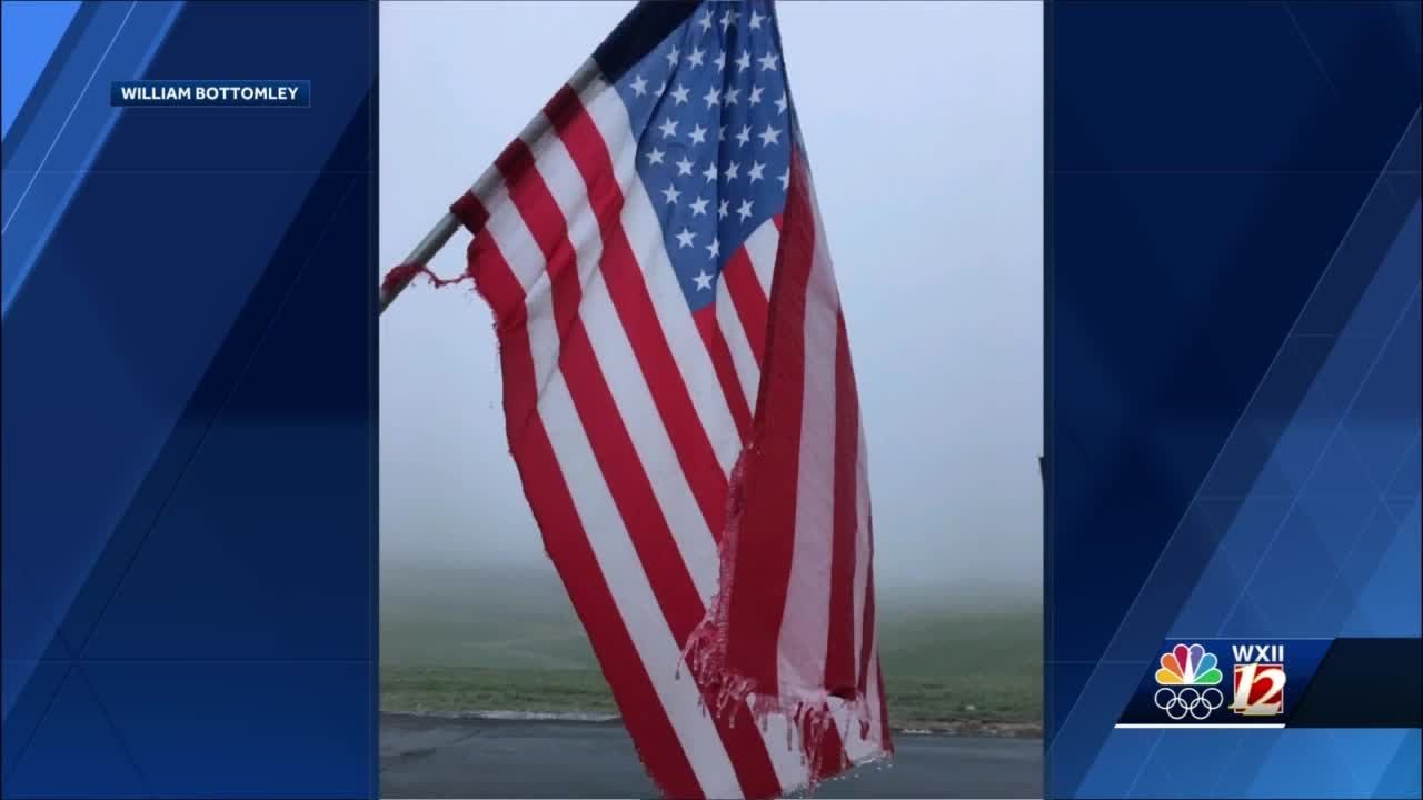 American flag frozen as icy glaze freezes portions of the Piedmont ...