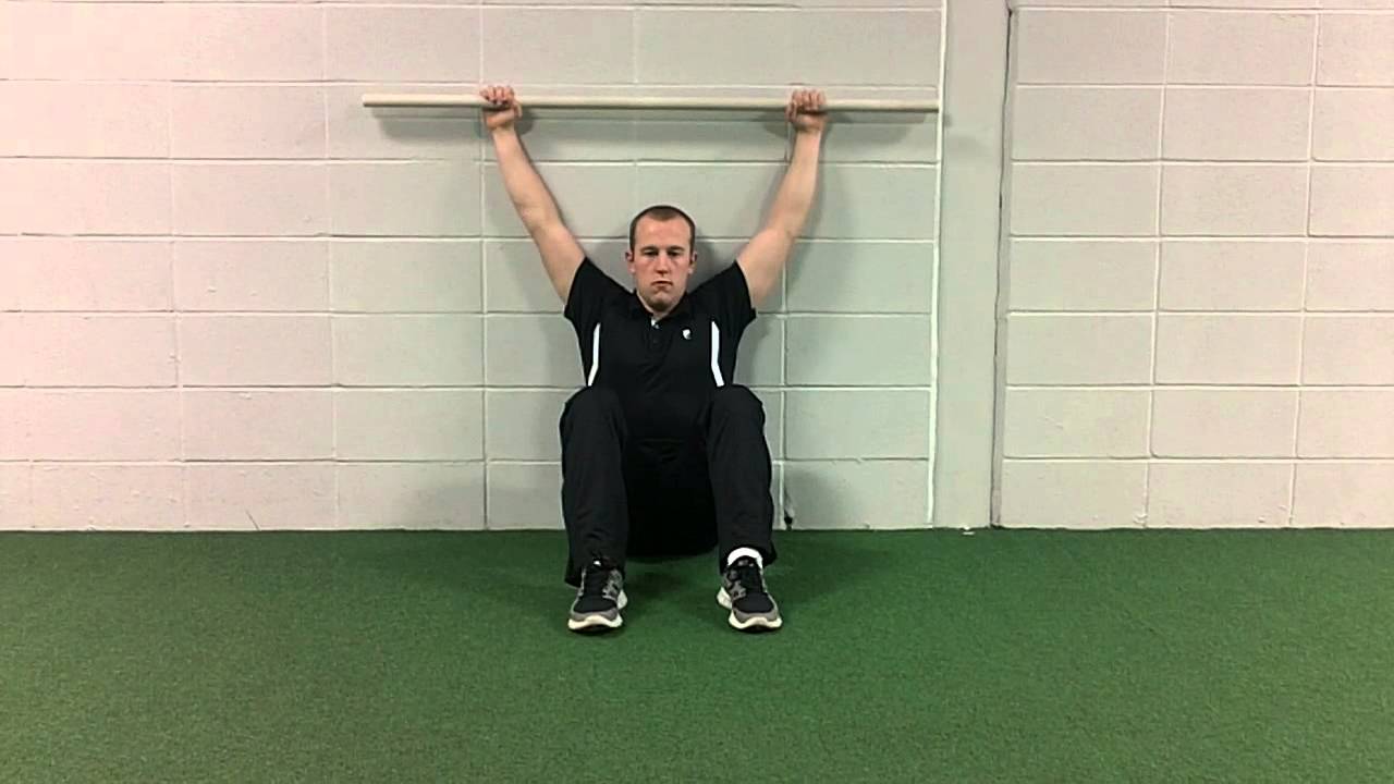 Wall Sit With Shoulder Flexion and Shoulder Press - YouTube