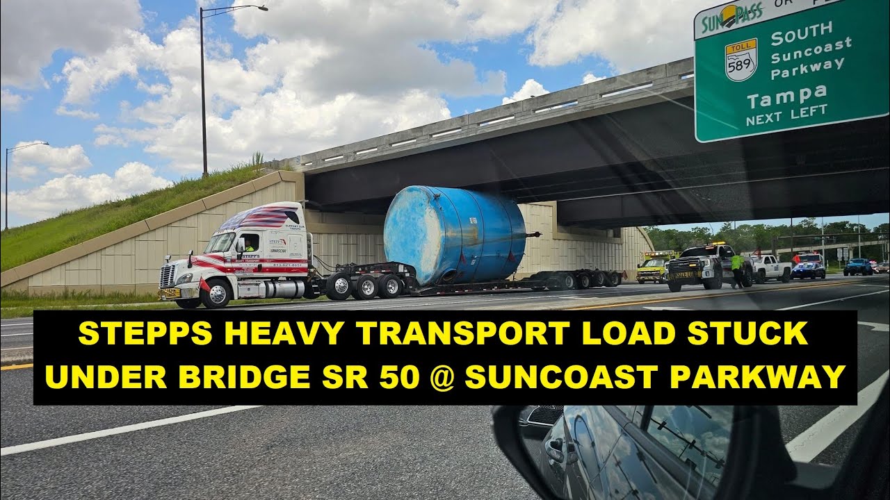 STEPPS HEAVY TRANSPORT STOPS TRAFFIC WHEN LOAD GETS PINNED UNDER BRIDGE ...
